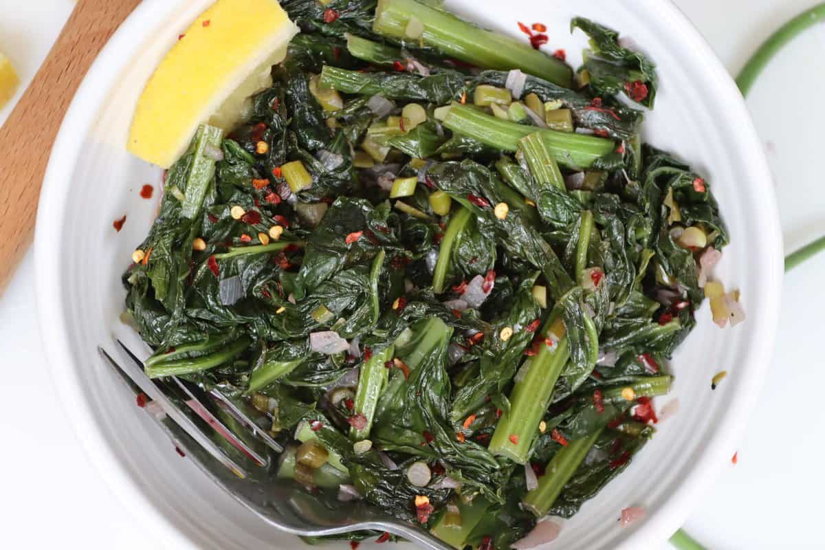 Sautéed Mustard Greens with Shallots, Garlic Scapes & Lemon - Eat the Bite