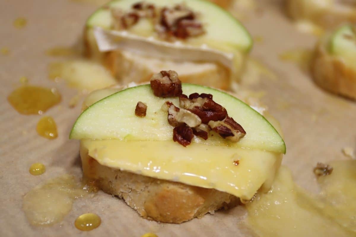 Apple Brie Crostini with Toasted Pecans and Drizzled Honey - Eat the Bite