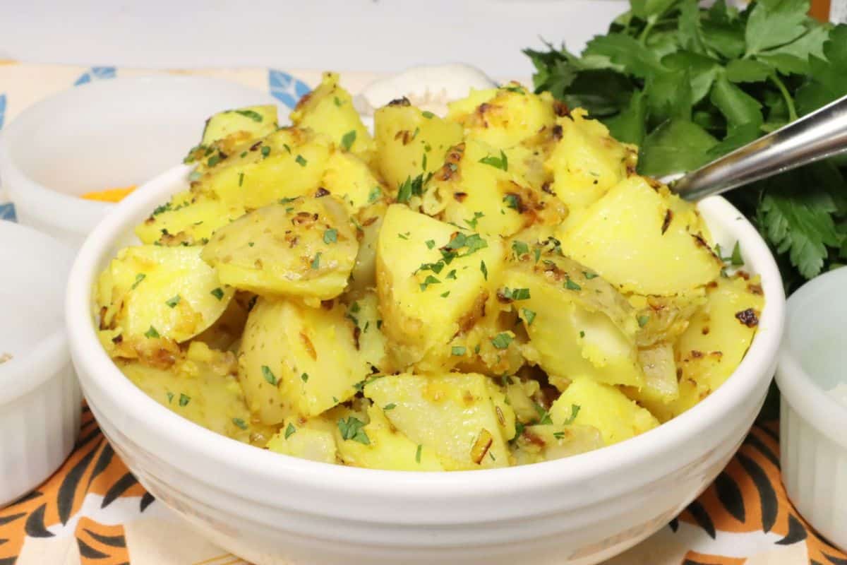 Yukon Potatoes with Fried Onions, Garlic, Cumin and Turmeric - Eat the Bite